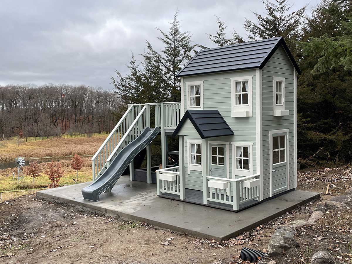 Explore the joy of backyard playhouses with slides and swings — perfec